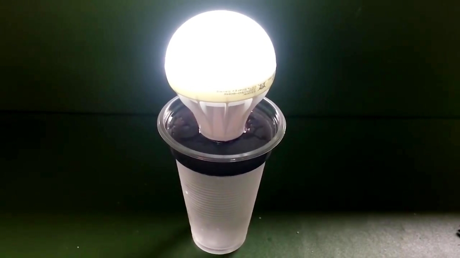 Science experiment free energy light bulb using salt water with magnet
